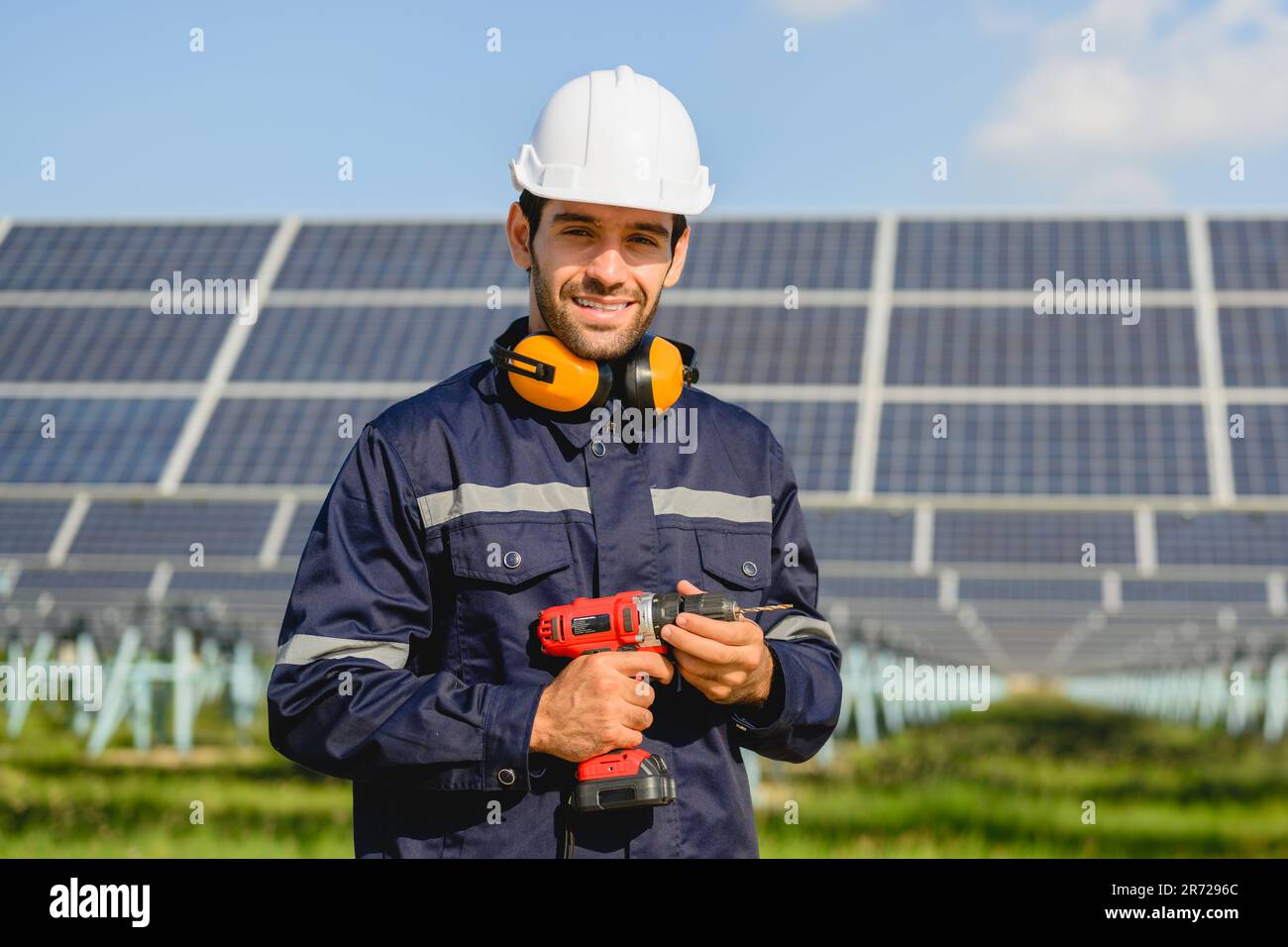Technician worker installing solar panels at solar cell farm Stock ...