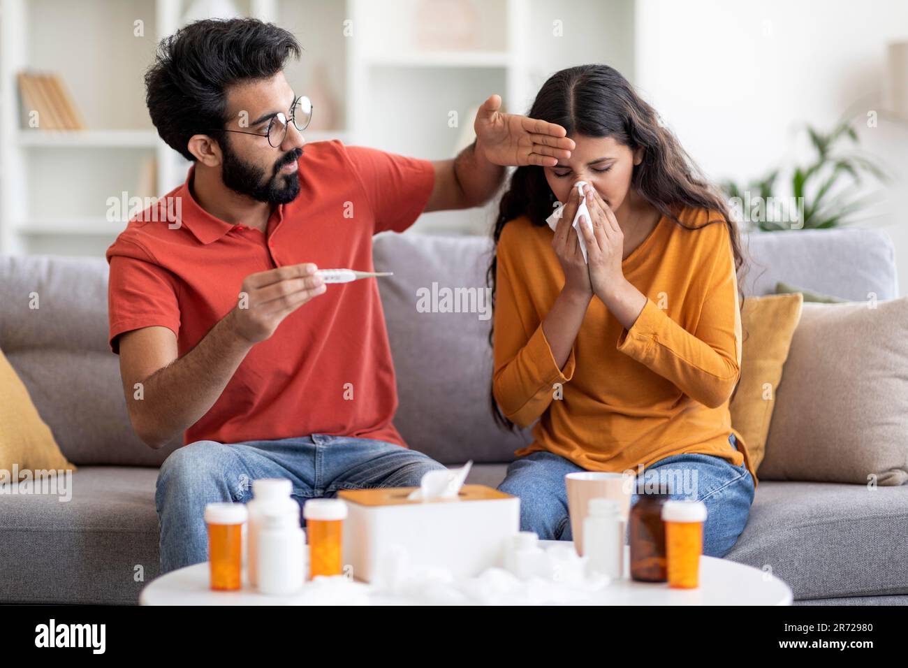 Flu And Cold. Indian Man Taking Care Of Ill Wife At Home Stock Photo ...