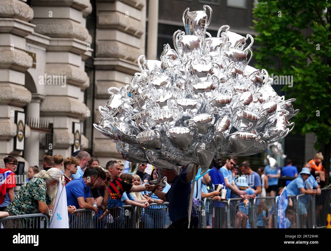 A street vendor with trophy balloons ahead of the Treble Parade in ...