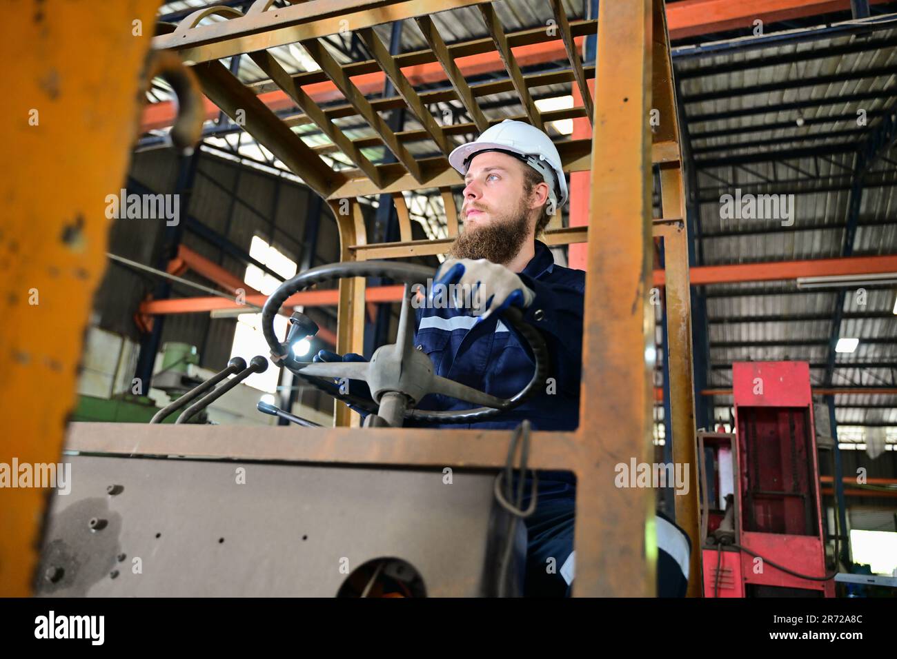 Mechanical engineer repairing engine machine at factory Stock Photo - Alamy