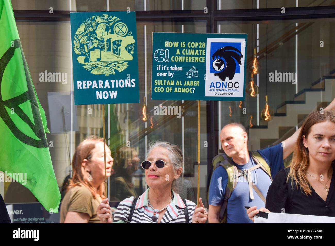 A climate activist holds a placard which criticises the election of ...