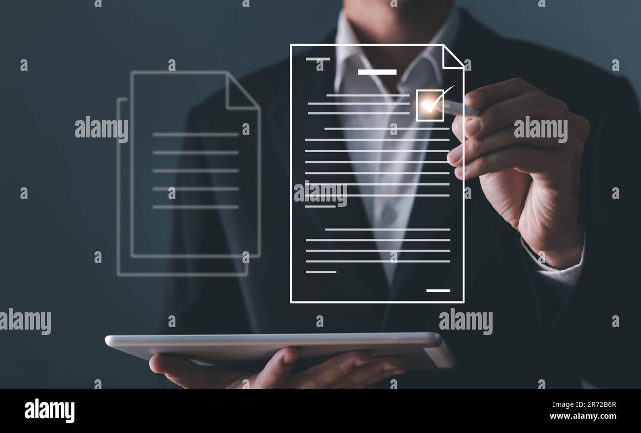 A businessman using a pen signing electronic documents on digital ...