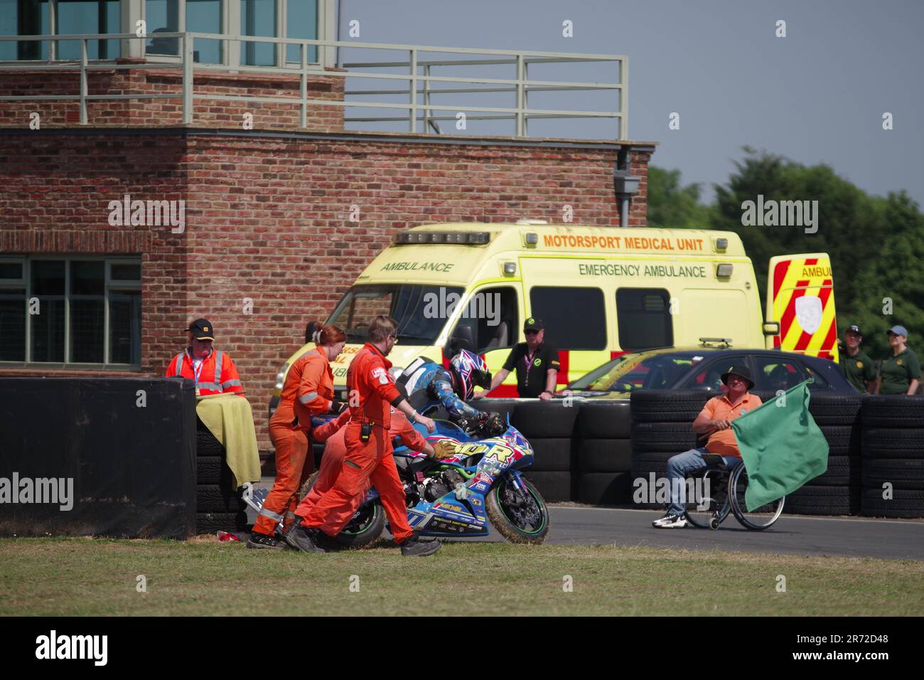 Croft Circuit, 10 June 2023. Marshals assisting Andy Smart and his Kawasaki 600 after breaking ...