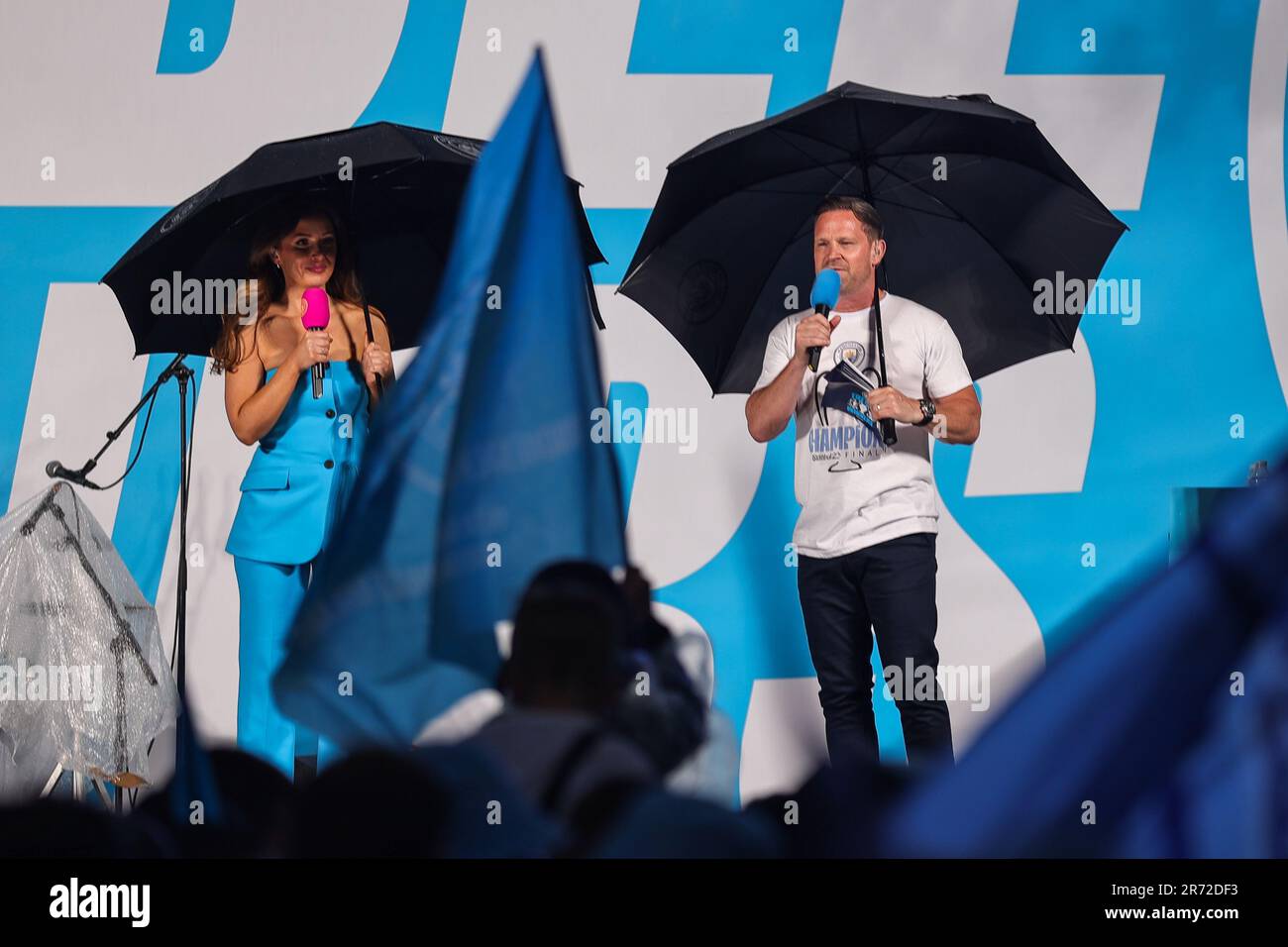 Danny Jackson and Natalie Pike on Stage with umbrella’s ahead of the ...