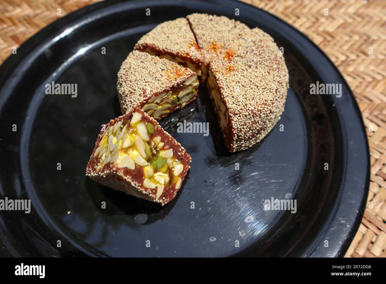 Indian sweets made of figs and dry fruits called Anjeer cake, covered ...