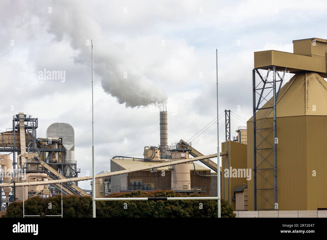 Photograph of steam coming from a chimney against a grey cloudy sky at ...