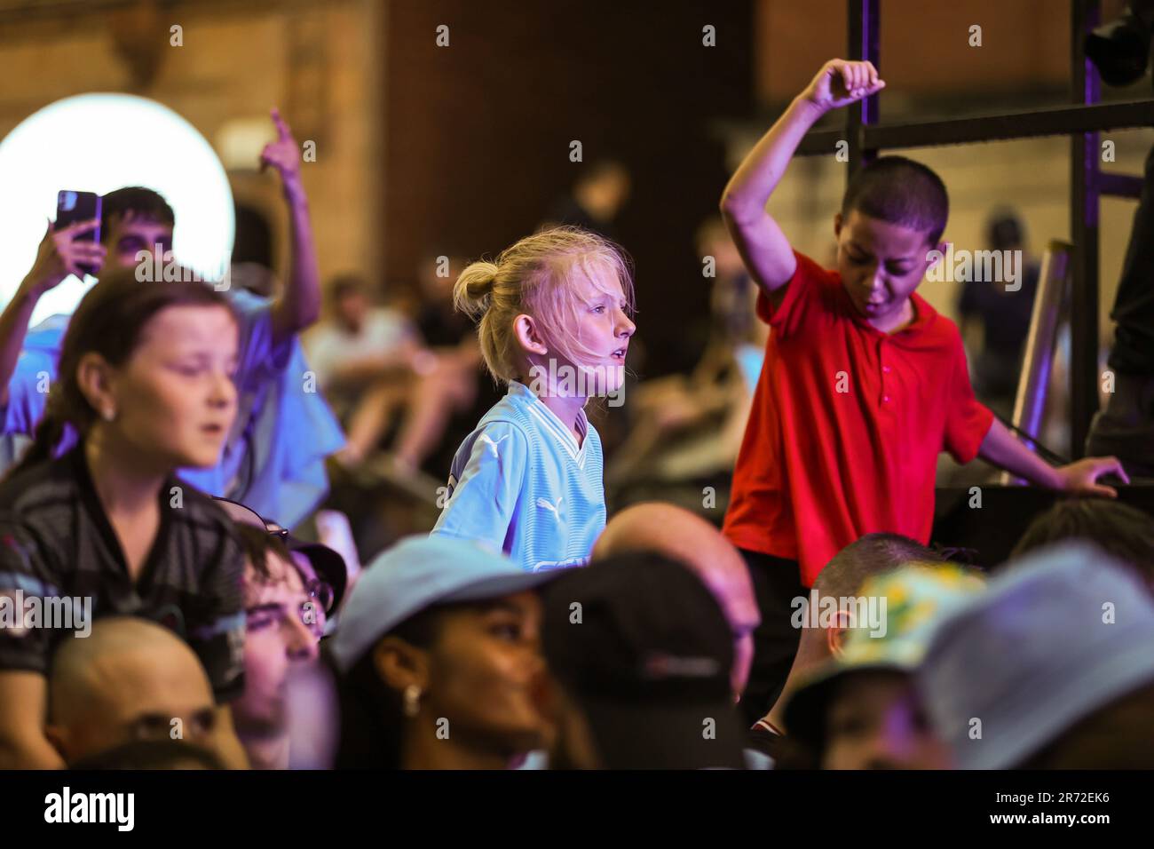 Young Fans during the Manchester City's Treble victory parade at St ...