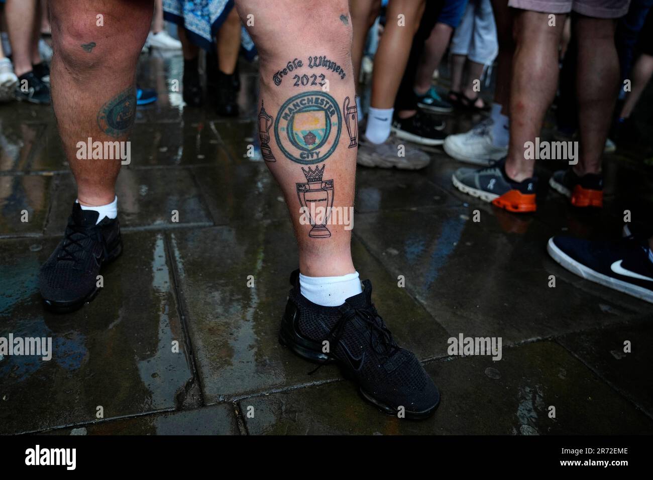 A Manchester football fan shows the tattoo on his leg ahead of ...