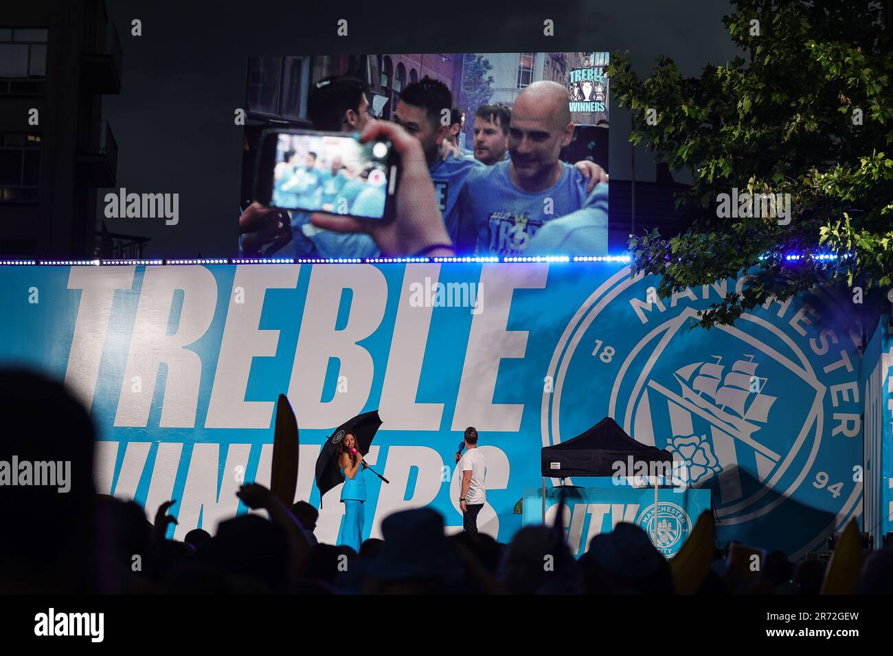 Pep Guardiola manager of Manchester City on the big screen during ...
