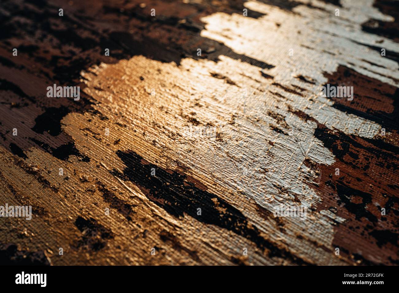 Abstract contemporary paint black oil strokes and glow golden shiny ...