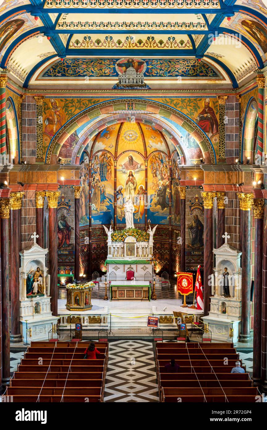 An altar adorned with religious iconography and intricate art pieces is ...