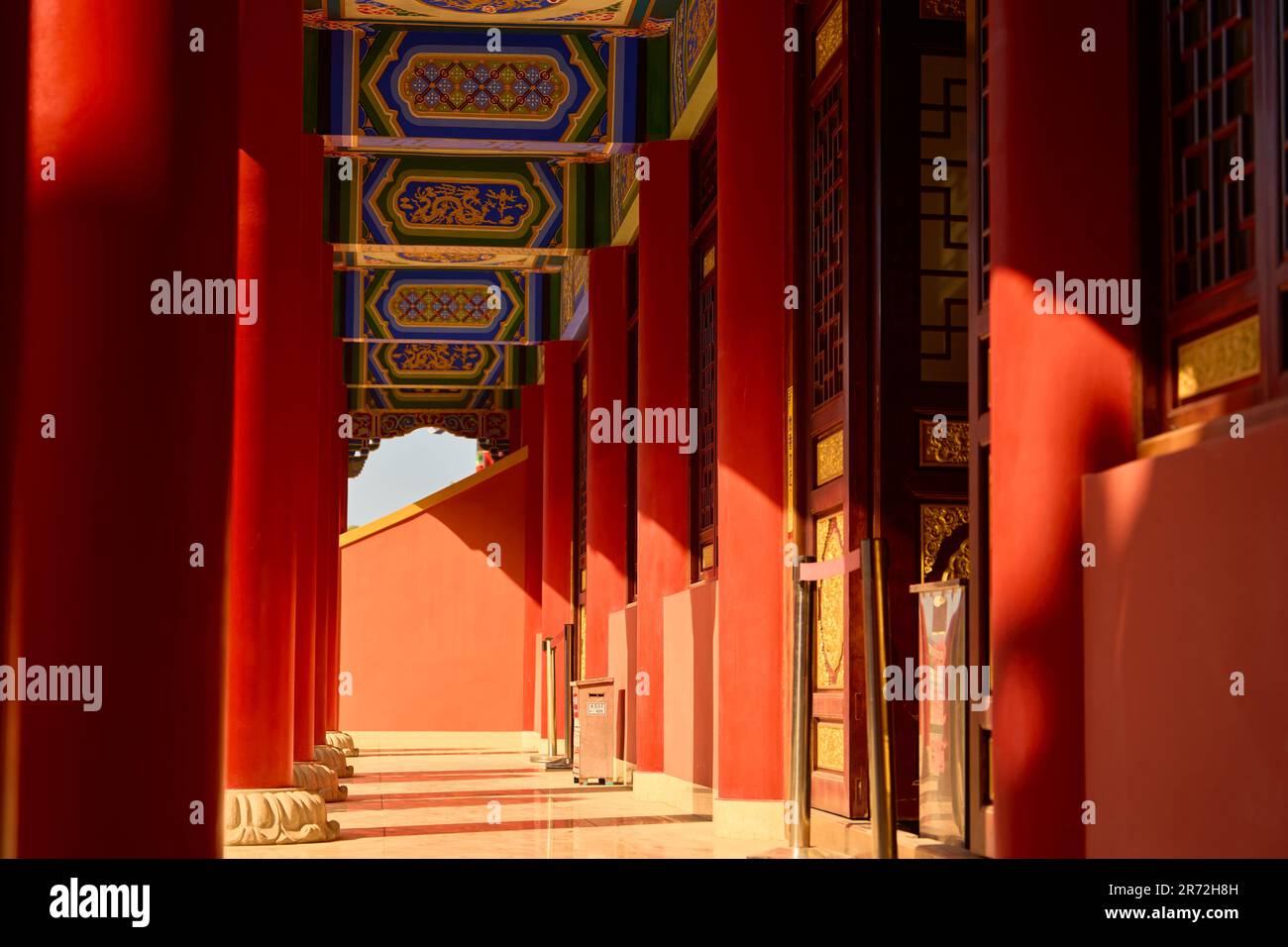 A closeup of archictural designs of red Asian-style buildings on a ...