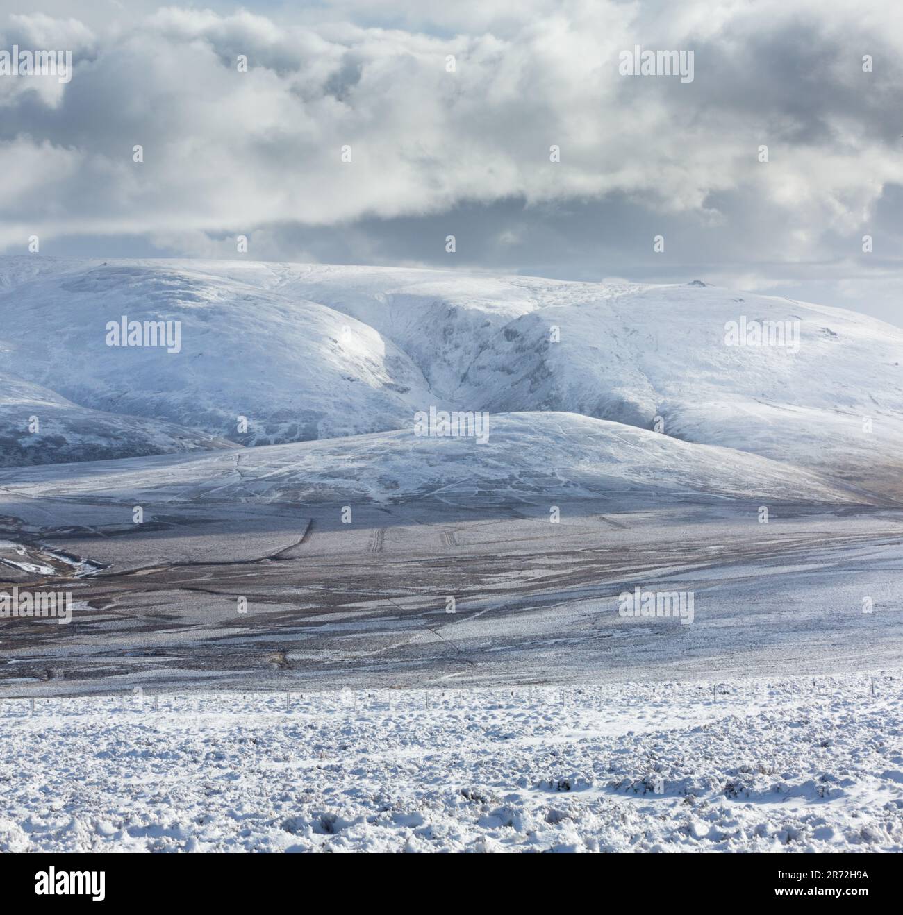 The Cheviot hills with a dusting of snow and cloud on the tops on a ...