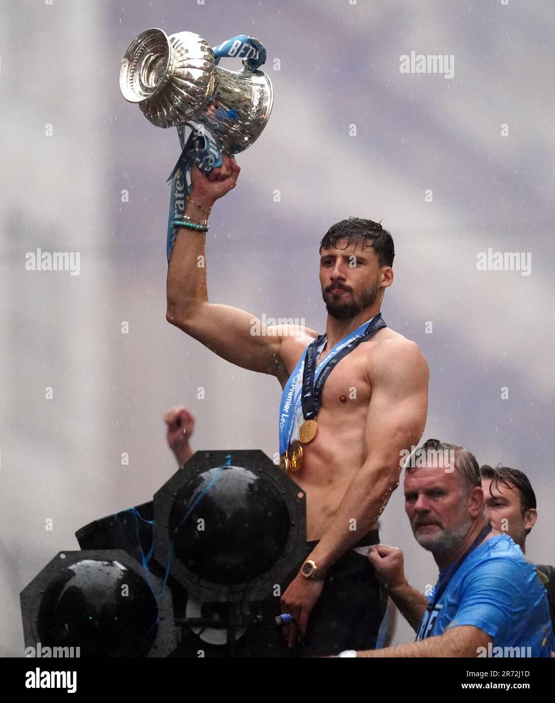 Manchester City's Ruben Dias with the FA Cup Trophy during the Treble Parade in Manchester ...