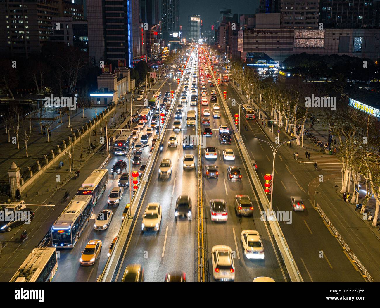 An aerial view of a bustling metropolis featuring a wide and busy ...