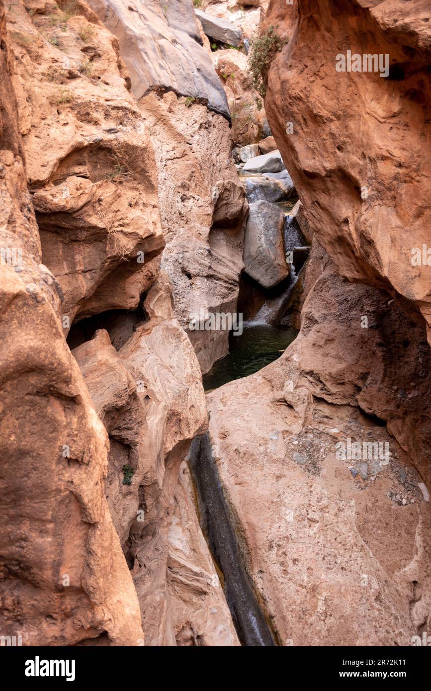 Hiking through the iconic Amtoudi canyon in the Anti-Atlas, Morocco ...