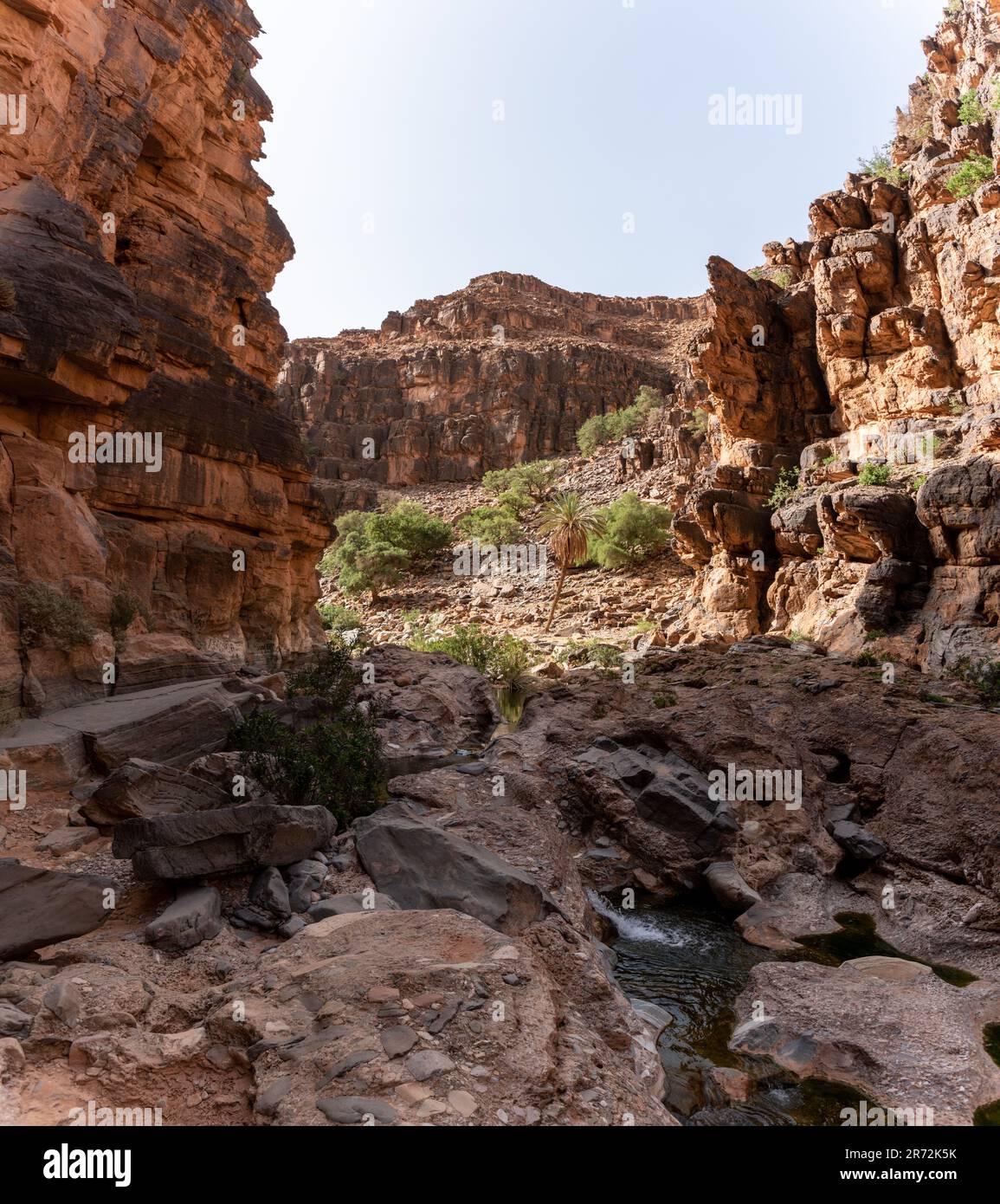 Hiking through the iconic Amtoudi canyon in the Anti-Atlas, Morocco ...