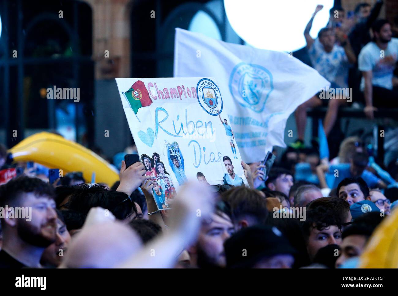 Fans hold up a banner for Manchester City's Ruben Dias during the ...