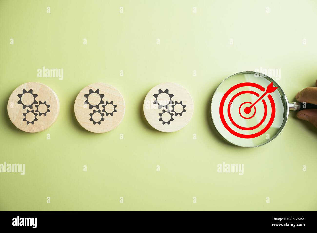 Magnifier in hand, close-up analysis of a target icon Stock Photo - Alamy