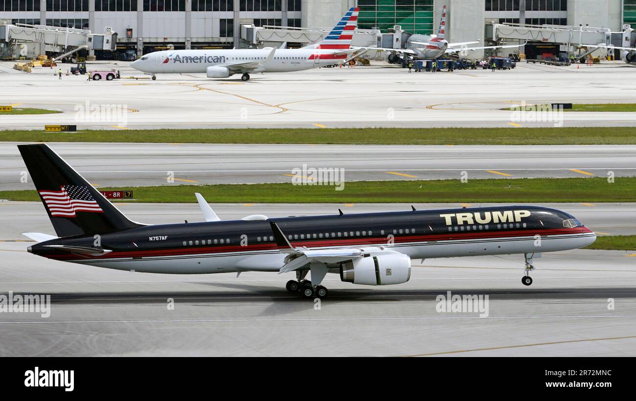 Former President Donald Trump, aboard his personal plane, arrives at ...