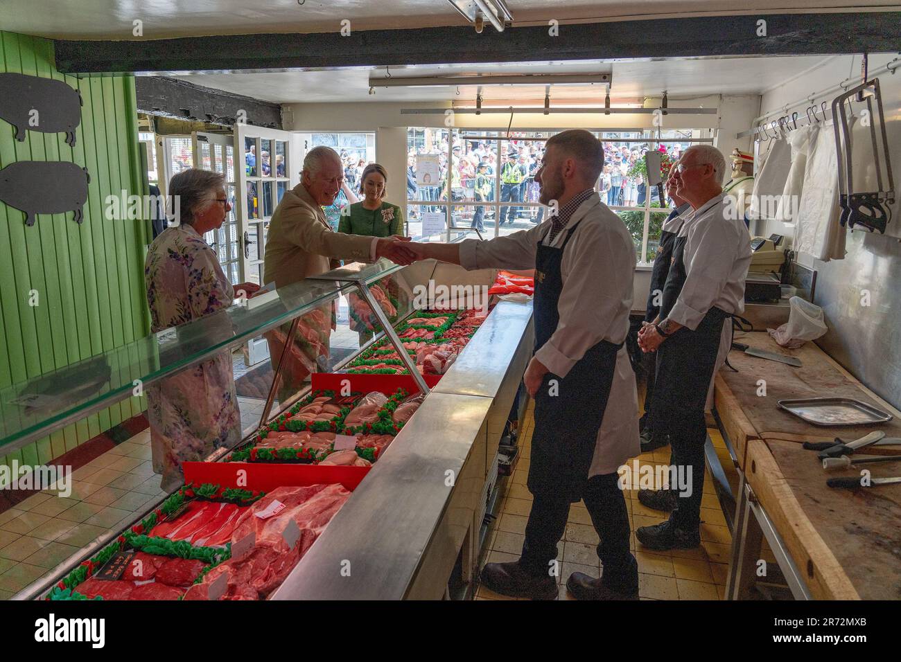 King Charles III in a family butchers shop during a visit to Pickering ...