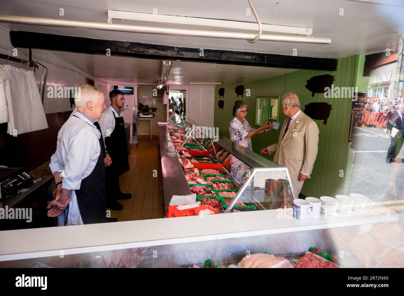 King Charles III in a family butchers shop during a visit to Pickering ...