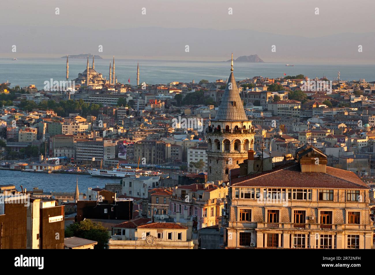 Rooftop view of Galata Tower and the Blue Mosque seen over the Golden ...