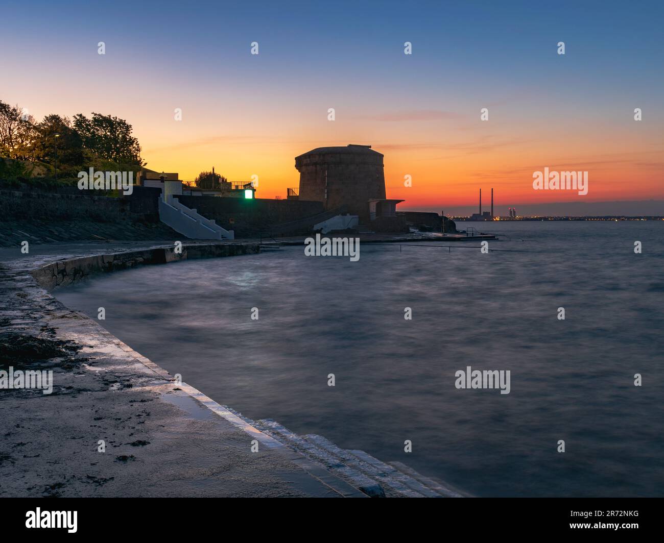 Long exposure of dusk at Seapoint Beach with the tide in Stock Photo ...