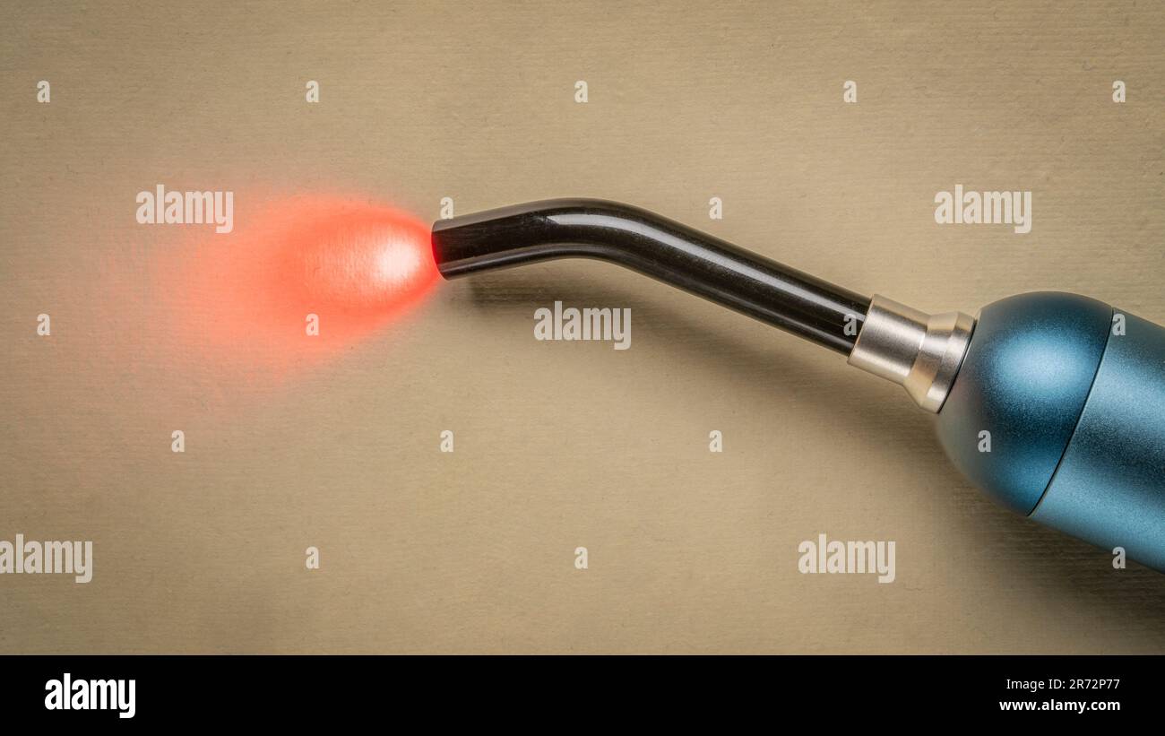 red an infrared light therapy - a small torch light for local treatment ...