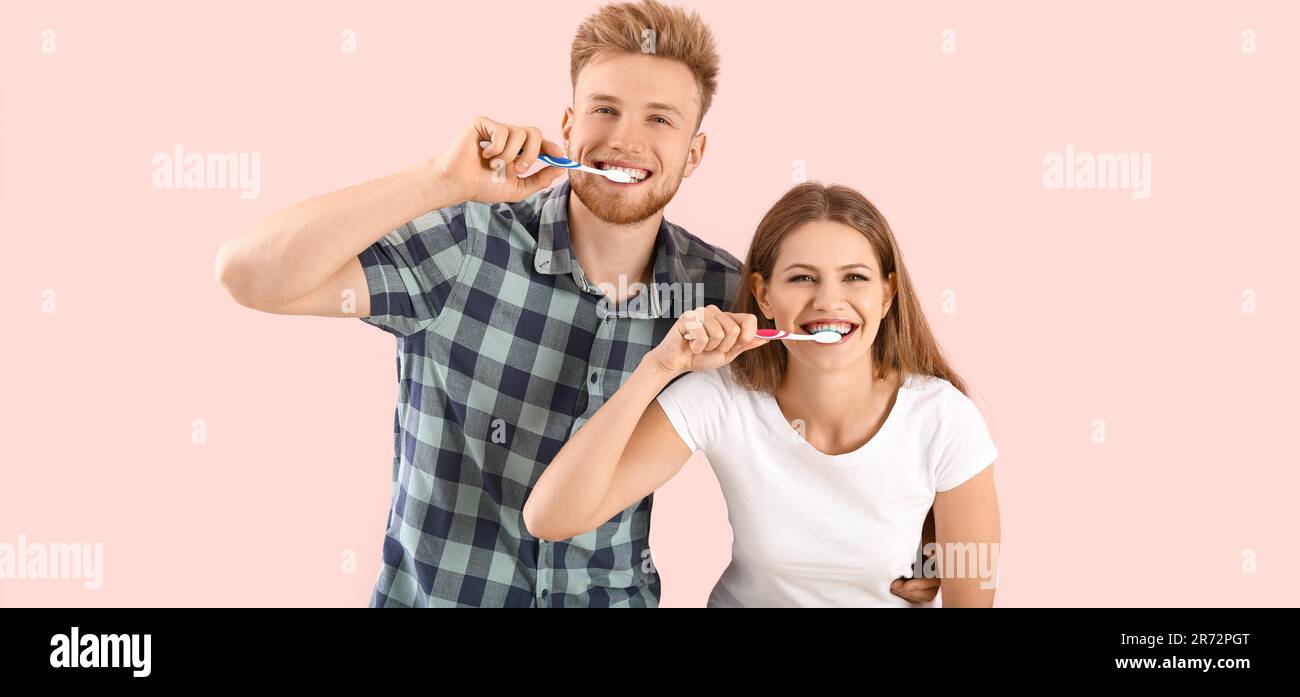Pink young woman brushing teeth hi-res stock photography and images - Alamy