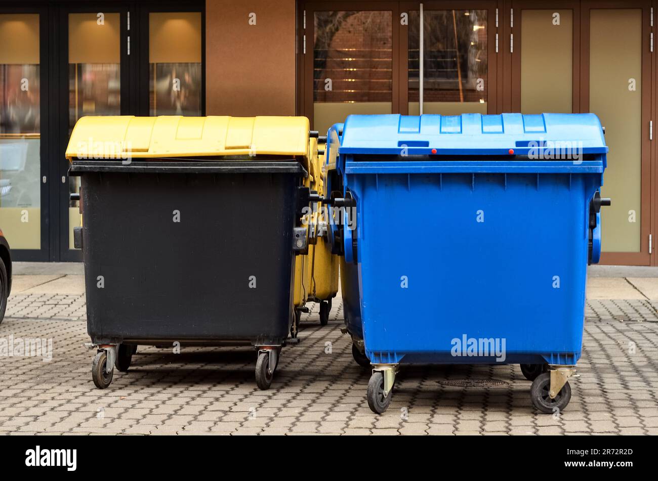 Garbage containers on city street Stock Photo - Alamy