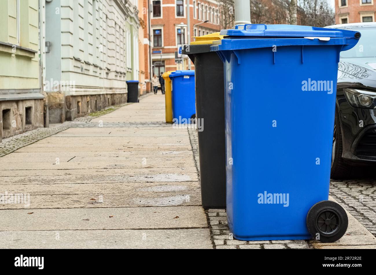 Garbage containers on city street Stock Photo - Alamy