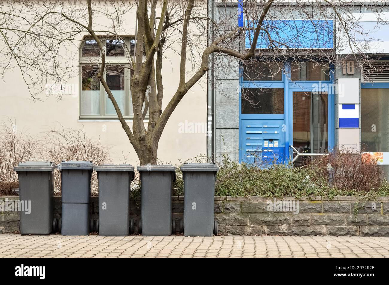 View of city street with garbage containers Stock Photo - Alamy