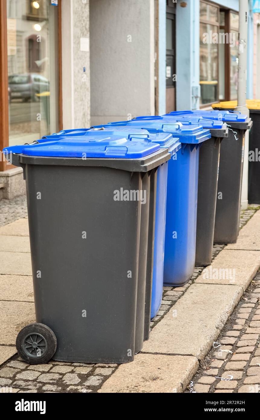 Garbage containers on city street Stock Photo - Alamy