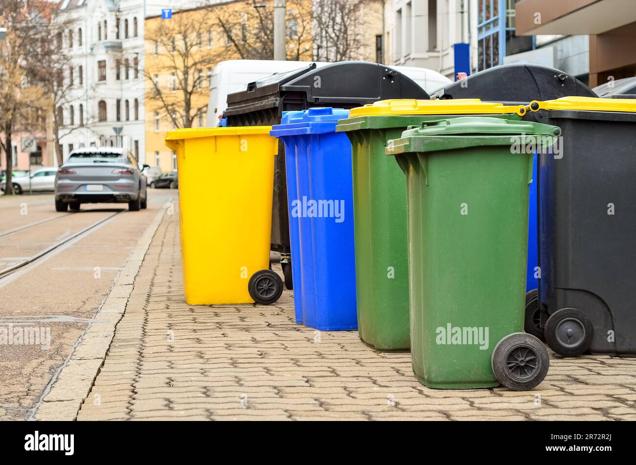 Garbage containers on city street Stock Photo - Alamy