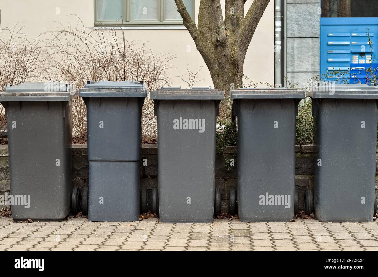 Garbage containers on city street Stock Photo - Alamy