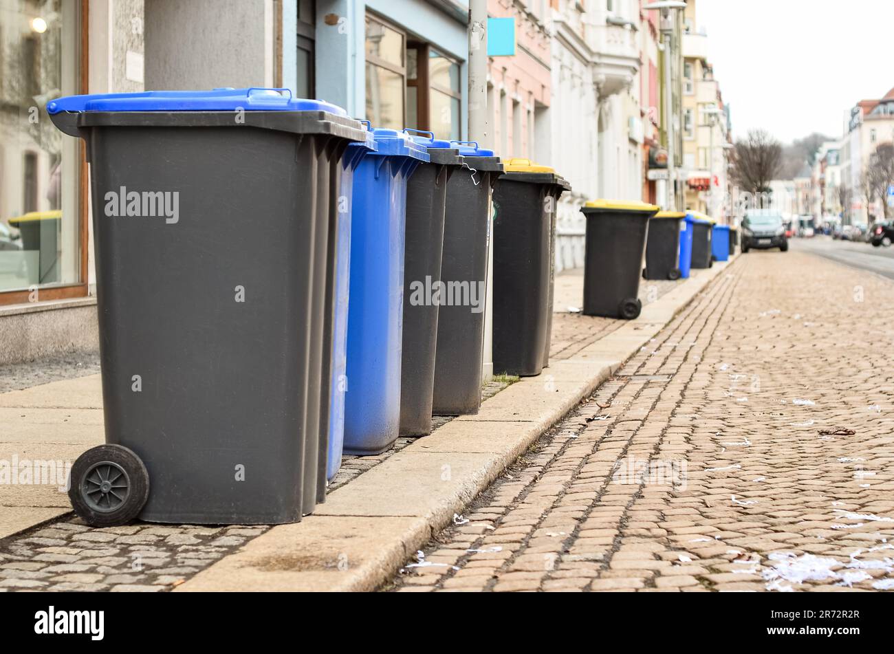 Garbage containers on city street Stock Photo - Alamy
