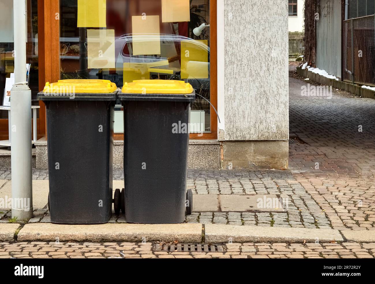 View of city street with garbage containers Stock Photo - Alamy
