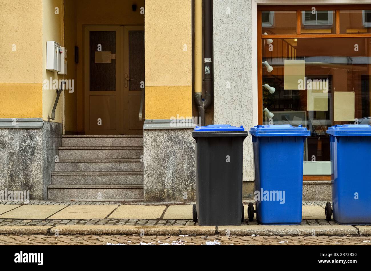 View of city street with garbage containers Stock Photo - Alamy