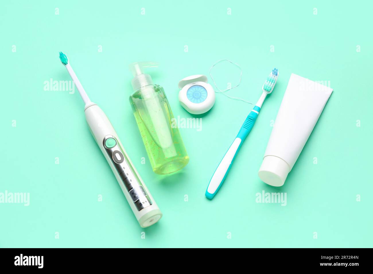 Set for oral hygiene on turquoise background Stock Photo - Alamy