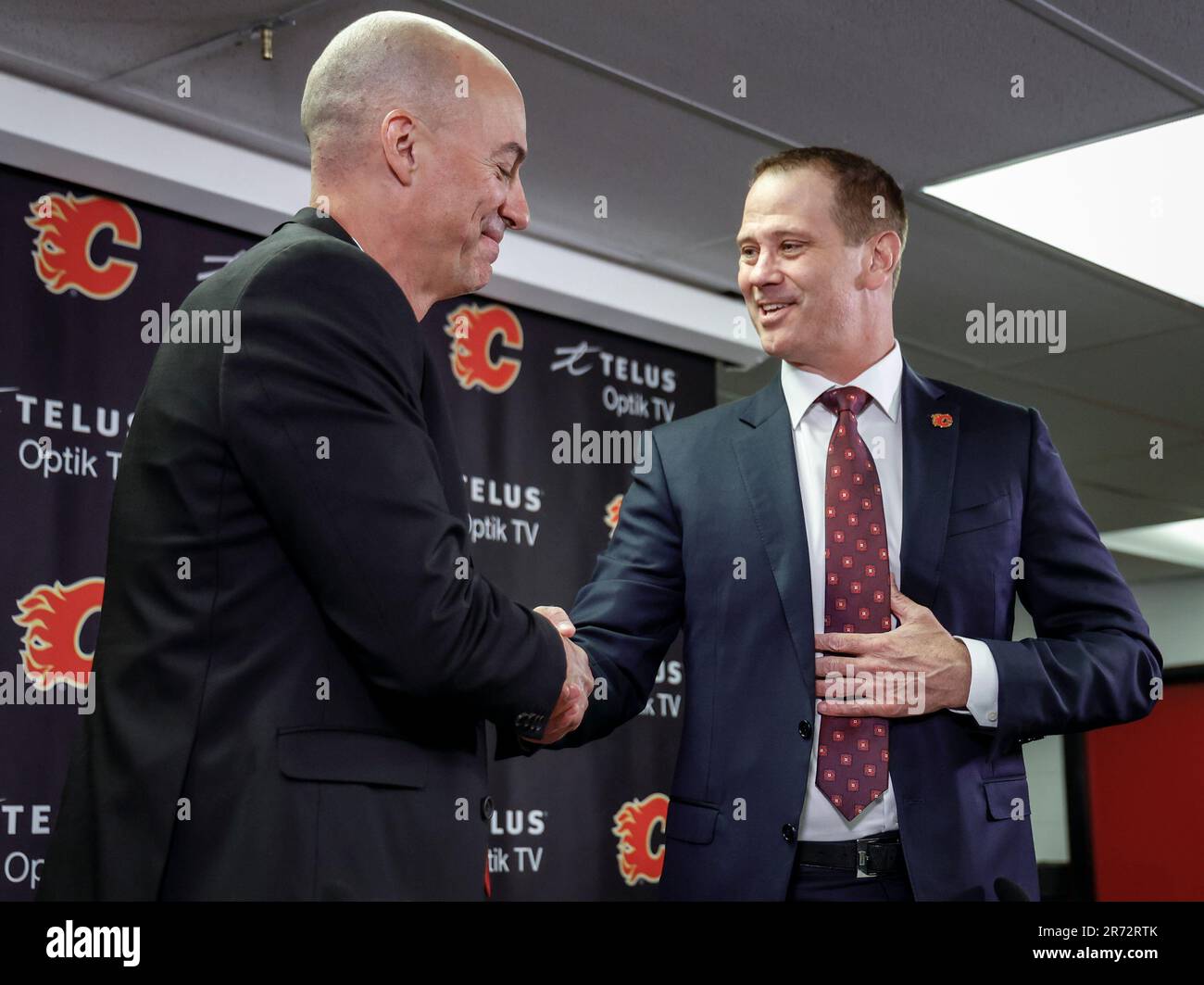 Calgary Flames General Manager Craig Conroy, right, welcomes Ryan Huska ...