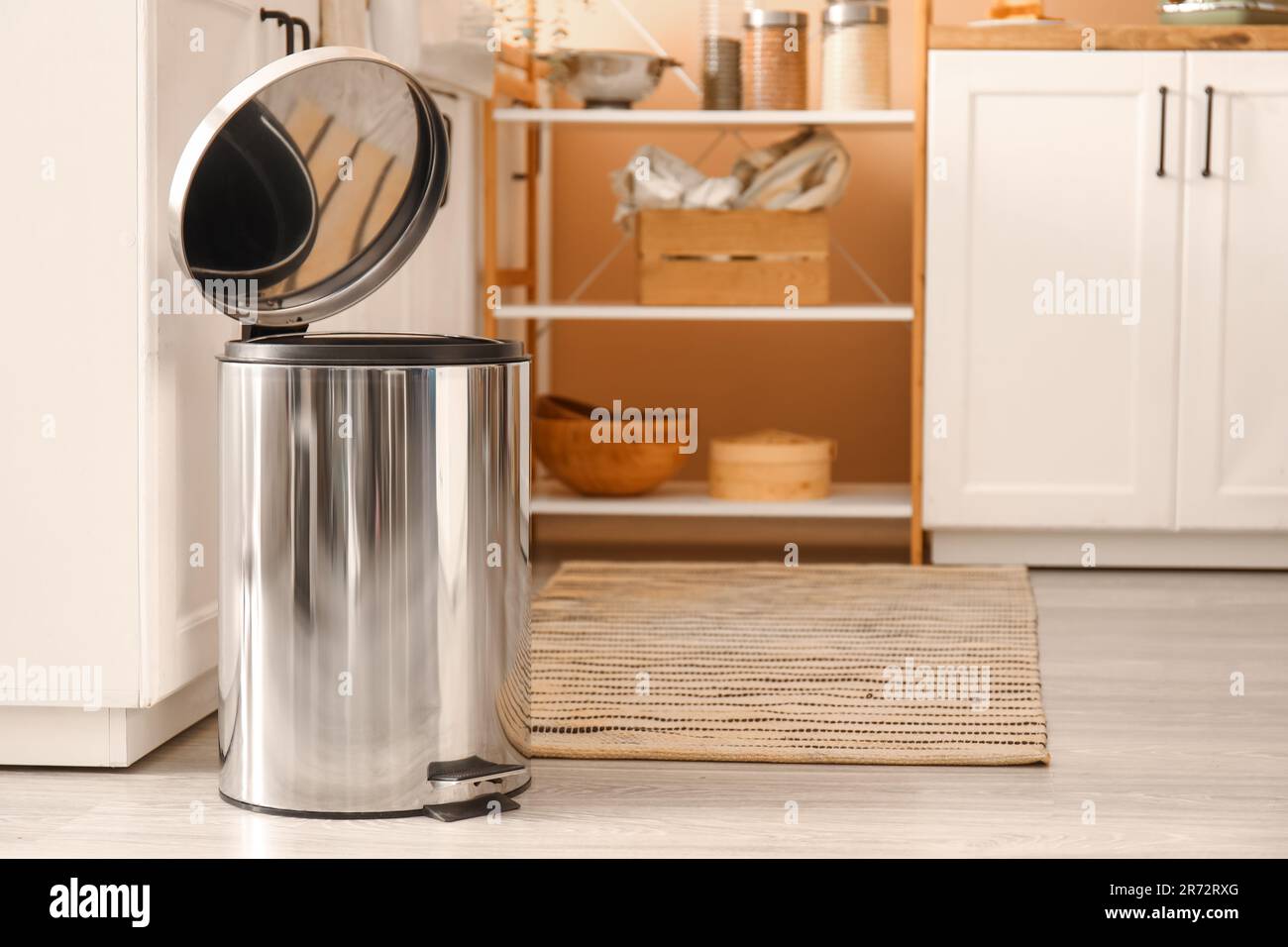 Opened metallic trash bin on floor in modern kitchen Stock Photo - Alamy