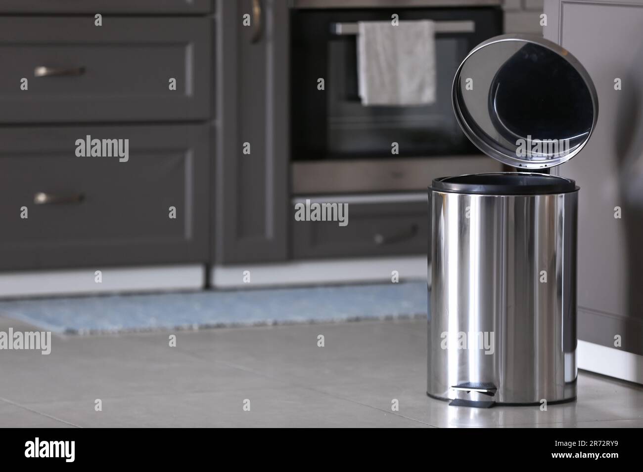 Opened metallic trash bin on floor in modern kitchen Stock Photo - Alamy