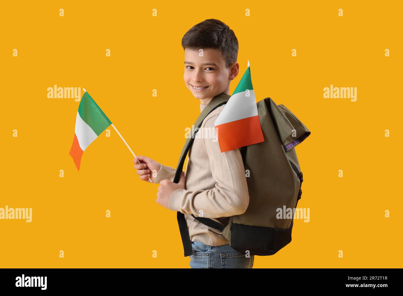 Little boy with backpack and flags of Italy on yellow background Stock ...