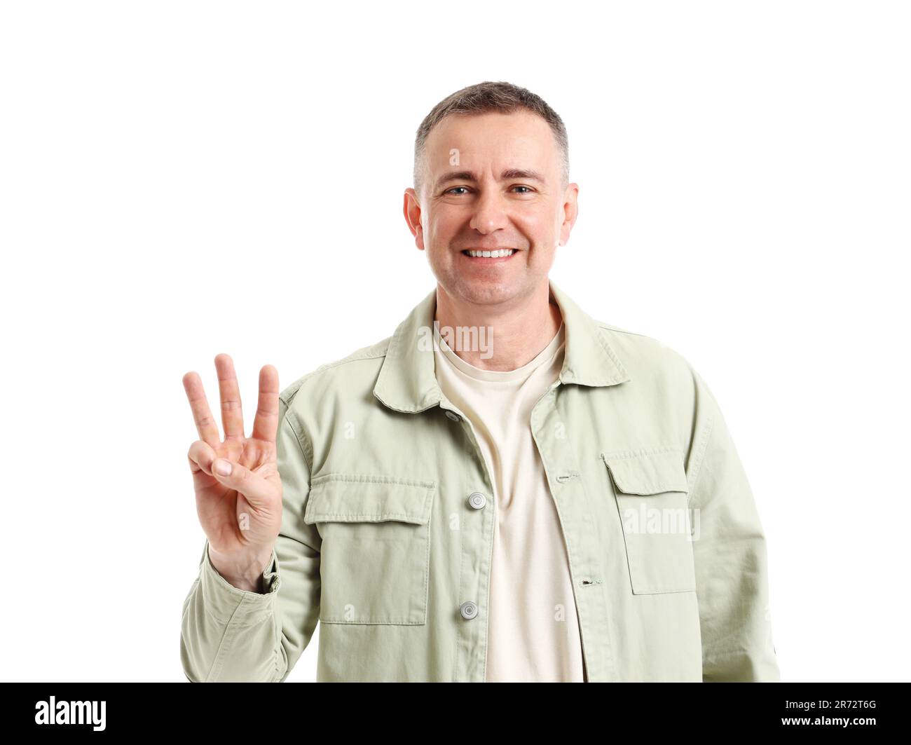 Mature man showing three fingers on white background Stock Photo - Alamy