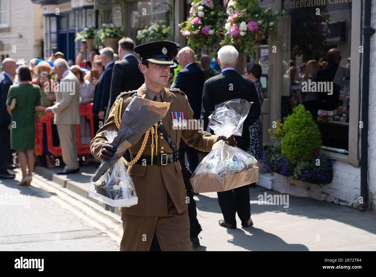 The King's assistant equerry carries some items as King Charles III ...