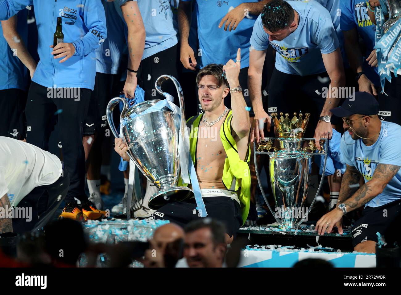 Manchester City's Jack Grealish celebrates on stage with their trophies ...