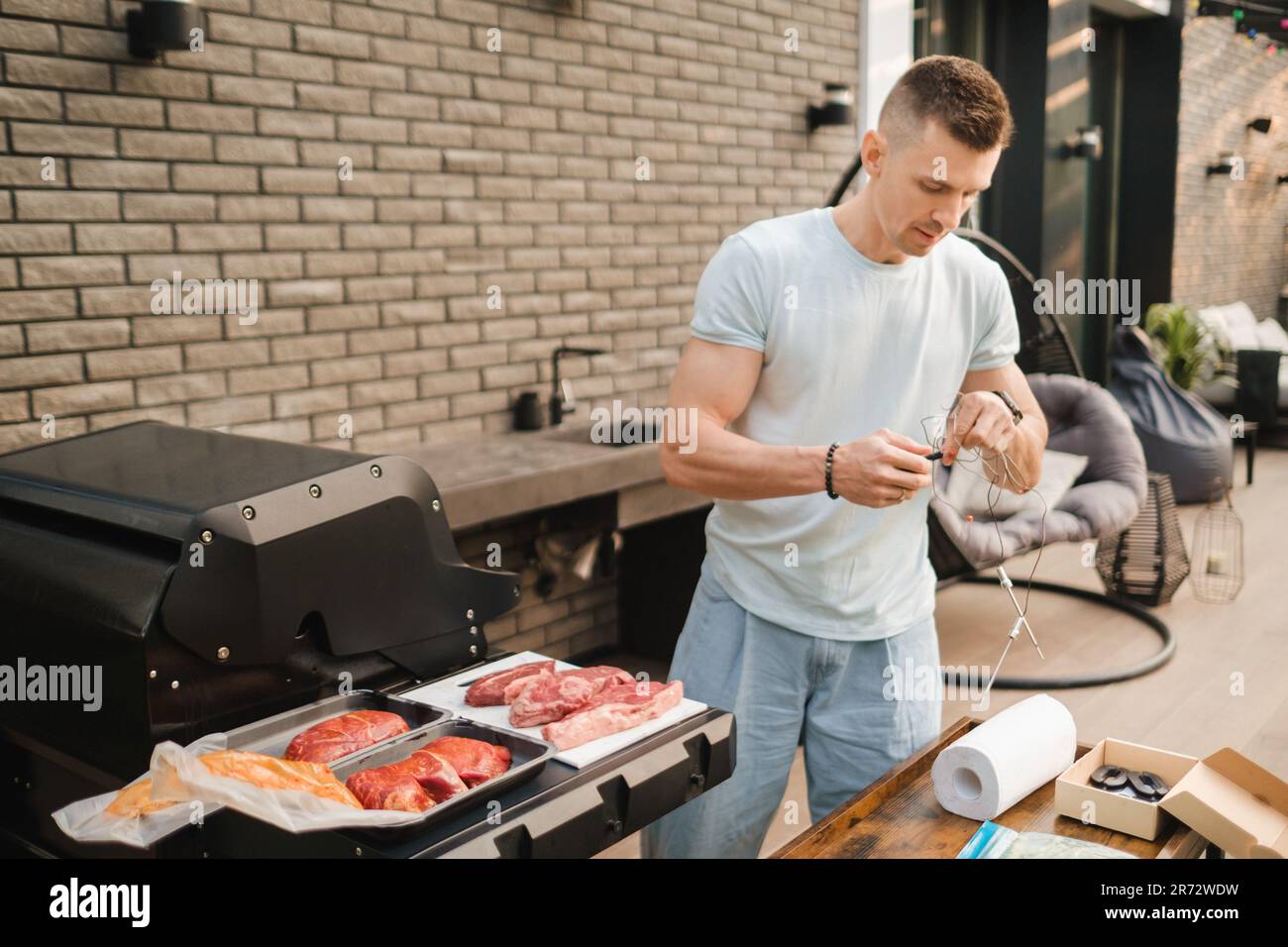 Cook lubricates grill hi-res stock photography and images - Alamy