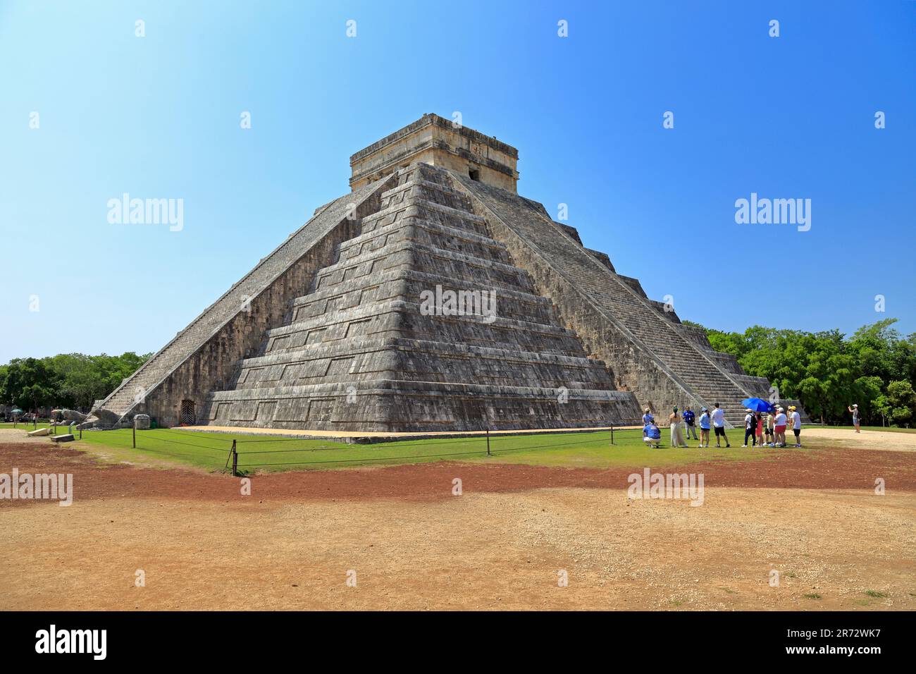 Tourists at the base of The Castle, El Castillo or Pyramid of Kukulcan ...