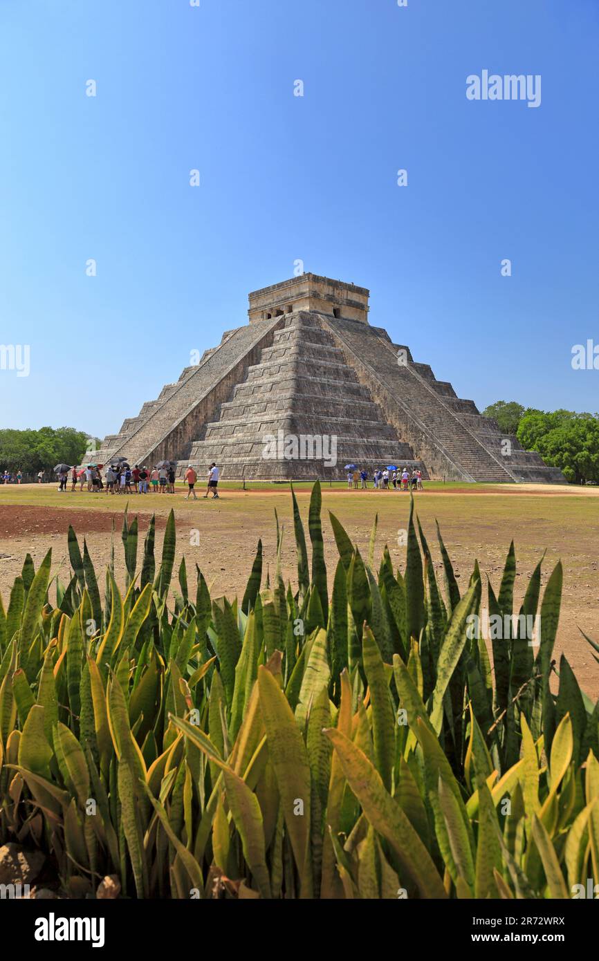 Tourists at the base of The Castle, El Castillo or Pyramid of Kukulcan ...